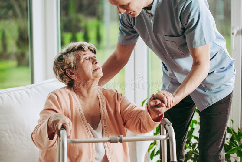 Trying to walk with walker stock photo. Image of care - 197352004