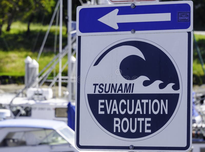 The Tsunami Evacuation Route Sign Features a Wave Symbol and Bold Text ...