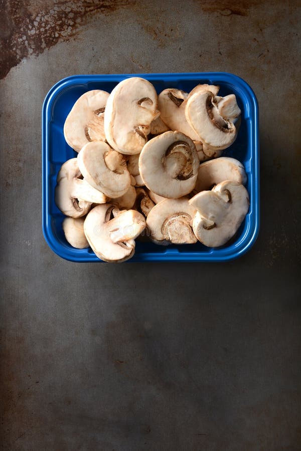 Tub of Sliced Mushrooms stock photo. Image of high, natural - 54702578