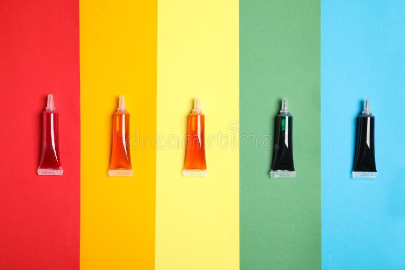 Tubes with Different Food Coloring on Rainbow Background, Flat Lay ...
