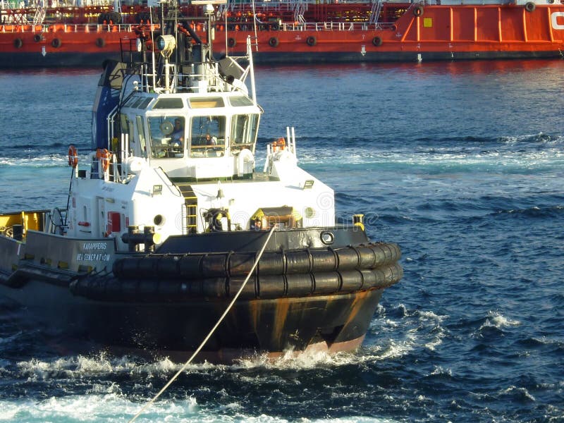 Tug boat in action editorial photo. Image of waterways - 146770406