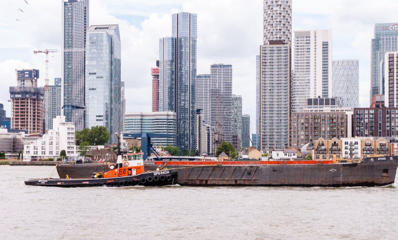Tug Boat Pulling Container Barge on the River Thames Editorial Stock ...