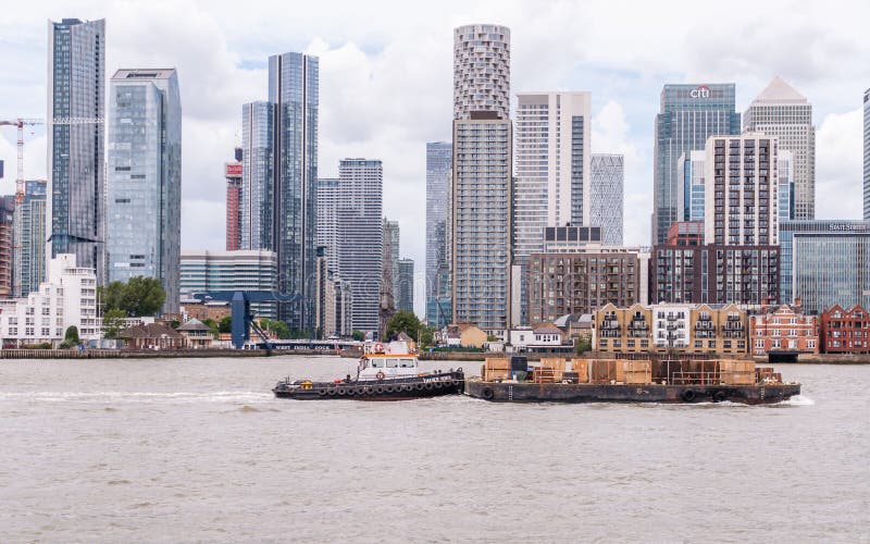 Tug Boat Pulling Container Barge on the River Thames Editorial ...