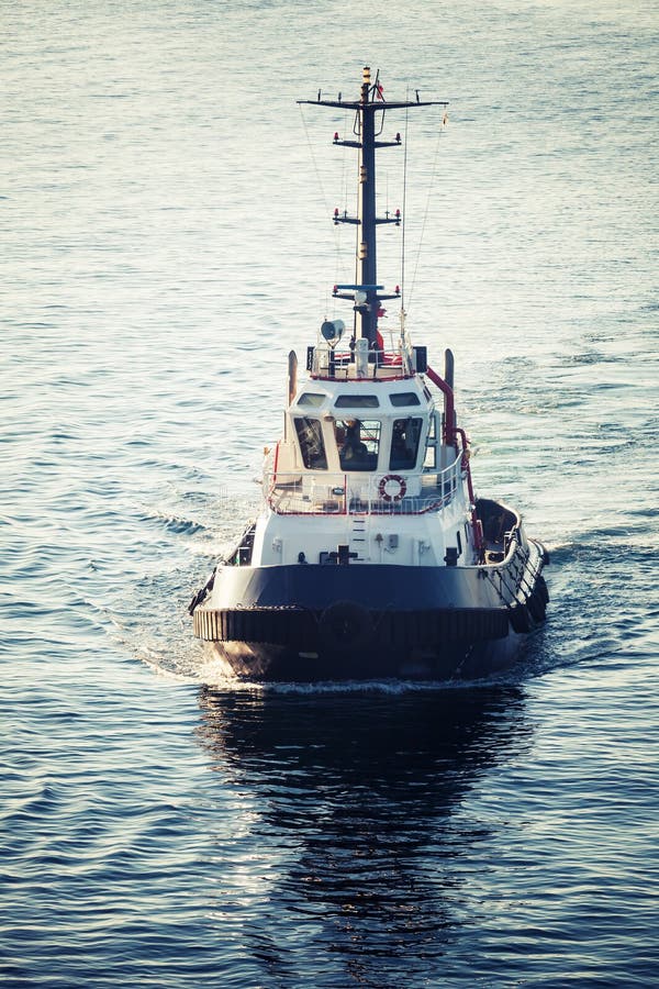 Tug boat underway stock photo. Image of coast, rope, ship - 85671384