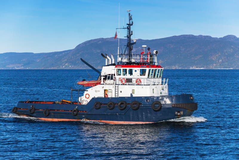 Tug boat underway stock photo. Image of coast, rope, ship - 85671384
