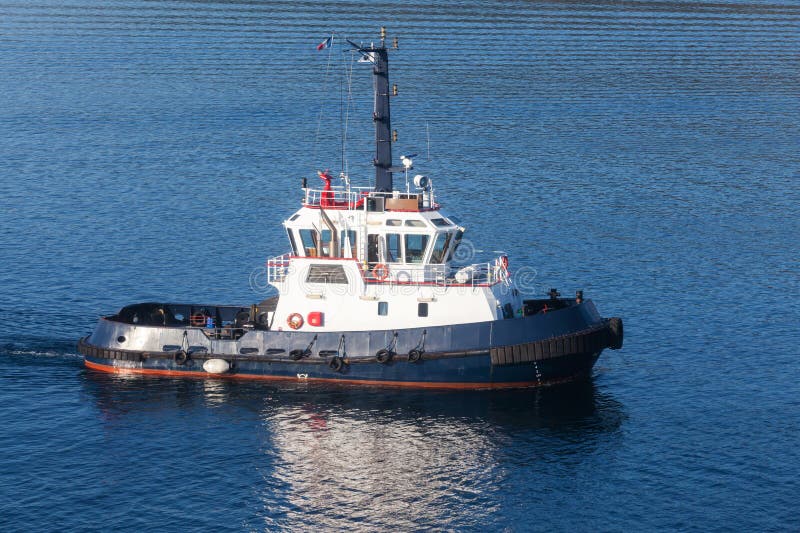 Tug Boat with White Superstructure and Dark Blue Hull Stock Image ...