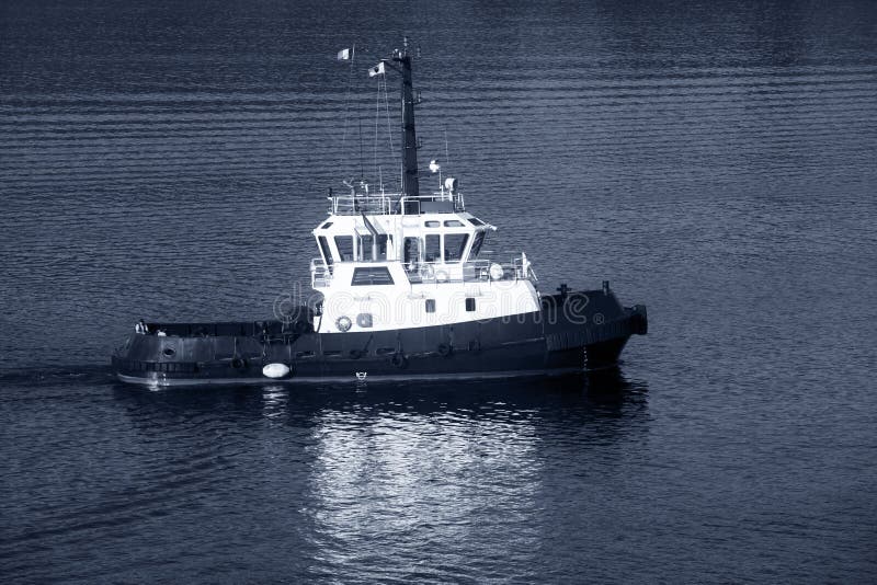 Tug boat underway stock photo. Image of coast, rope, ship - 85671384