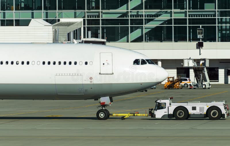 TUG Pushback Tractor with Aircraft. Stock Image - Image of ground ...