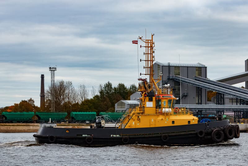 Tug ship in the cargo port stock image. Image of delivering - 88609765