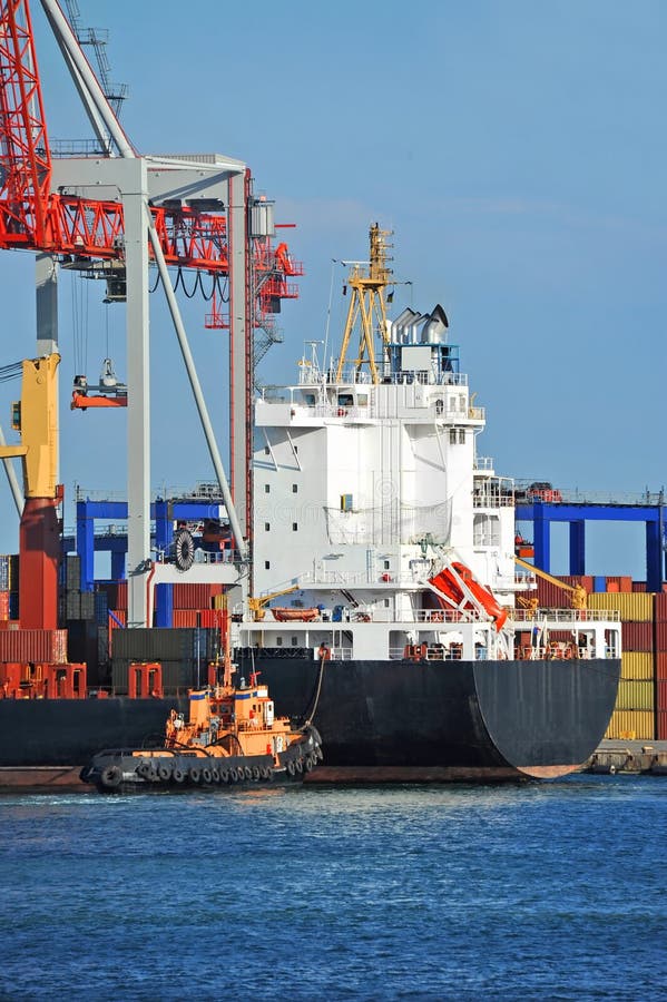 Tugboat Assisting Container Cargo Ship Stock Photo - Image of quayside ...