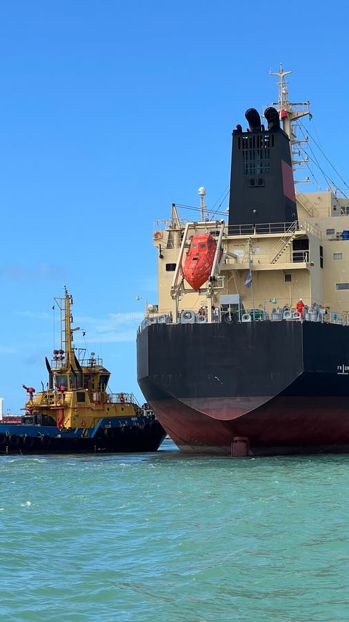 Tugboat Assisting Ship Docking at Port Stock Photo - Image of channel ...