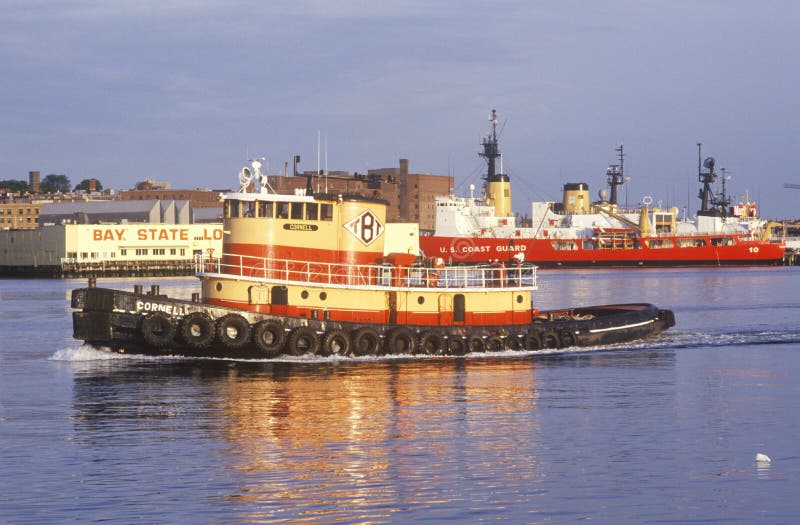 Tugboat with Boston Harbor and the Boston Skyline at Sunrise As Seen ...