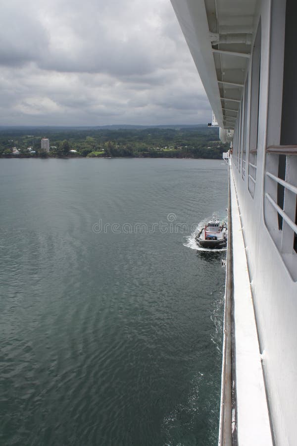 Tugboat docks cruise ship stock image. Image of maritime - 50789743