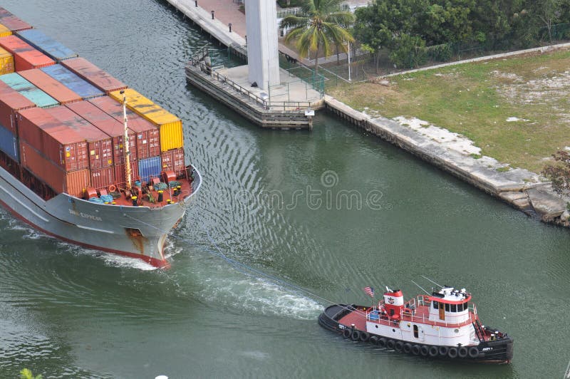 Tugboat guides barge editorial stock photo. Image of small - 31640128