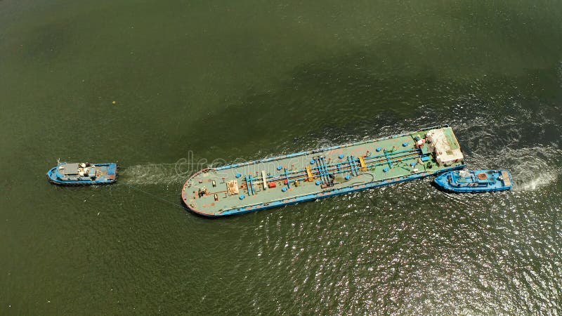 Tugboat Pulling Heavy Loaded Barge. Stock Image - Image of vessel ...