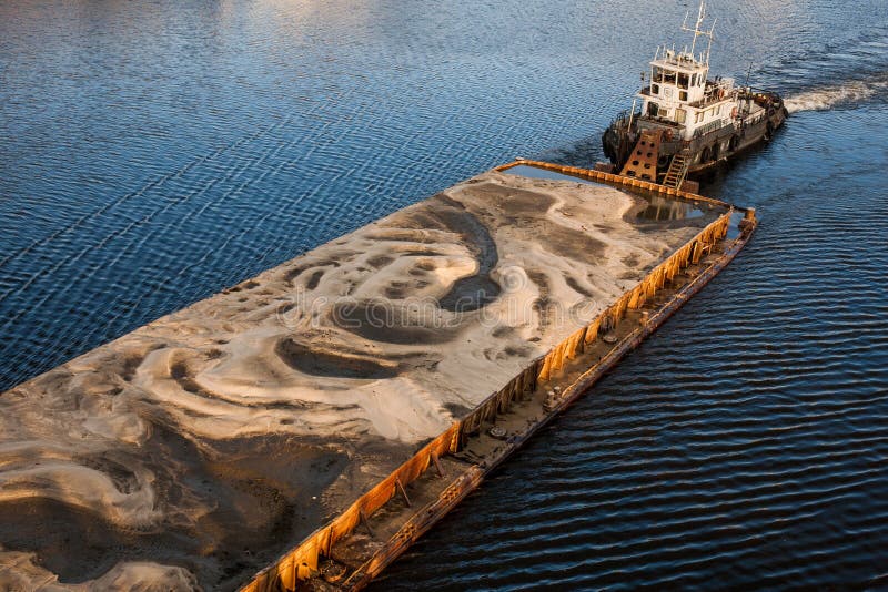Tugboat pushing barge stock image. Image of nautical - 259378375