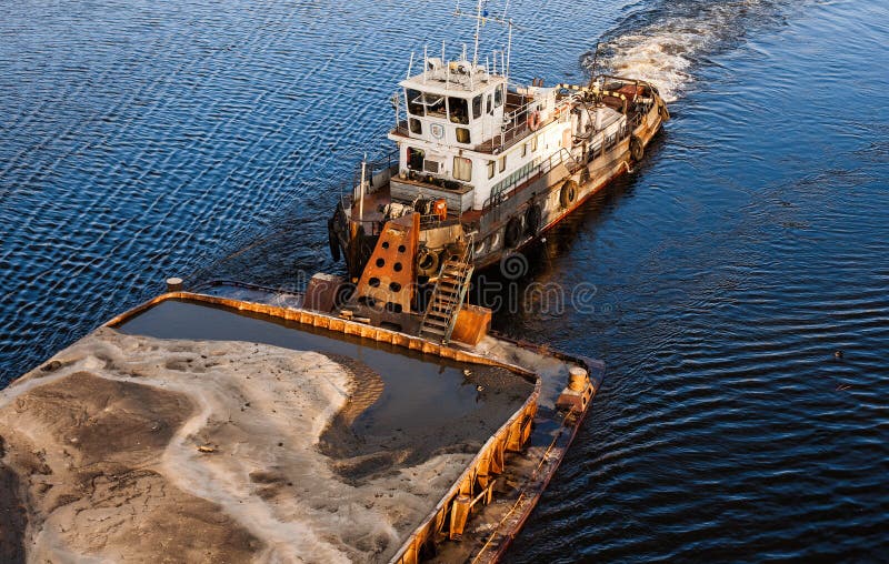 Tugboat pushing barge stock image. Image of container - 259378381