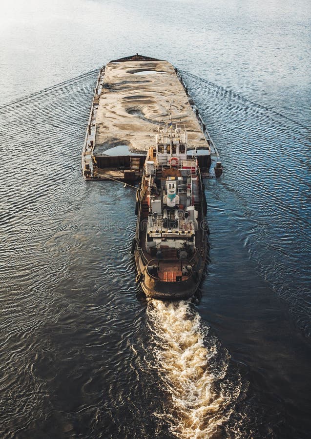 Tugboat pushing barge stock image. Image of cargo, nautical - 259378397