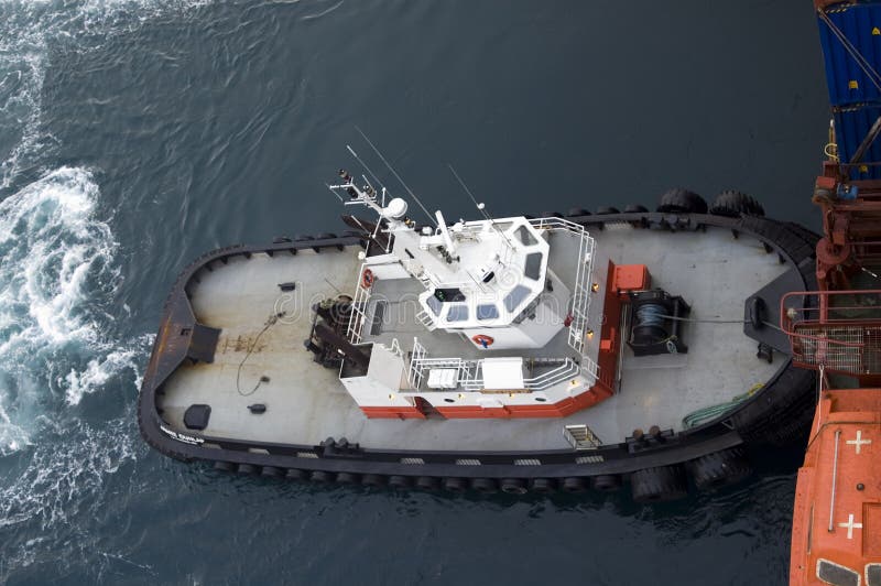 Tugboat Pushing on a Containership Stock Image - Image of ship ...