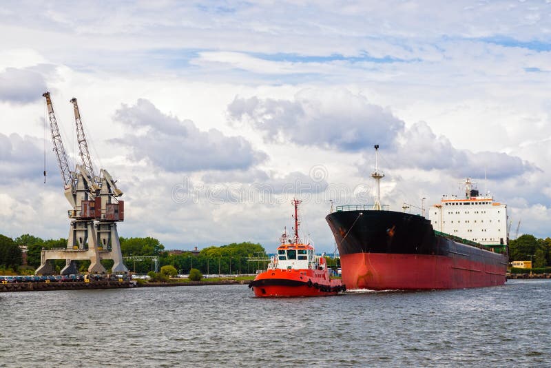 Tugboat towing a ship stock image. Image of push, commercial - 27804065