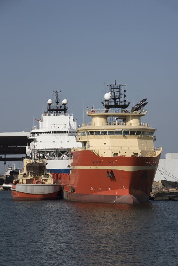 Tugboats alongside in port stock photo. Image of boat - 95264844