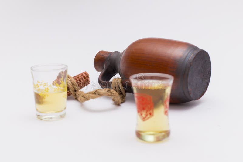 Empty Bottle and Two Glasses Filled with Tuica Stock Image - Image of ...