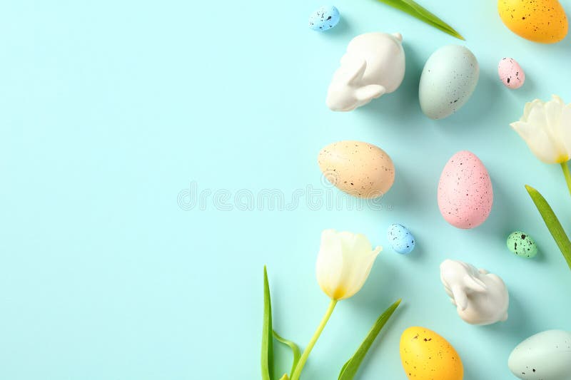Tulips, Easter Eggs, Bunnies on Pastel Blue Background. Happy Easter ...