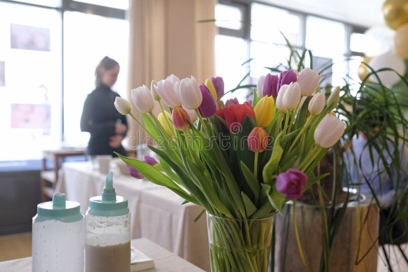 Tulips in a Vase at an Office Reception Stock Photo - Image of office ...