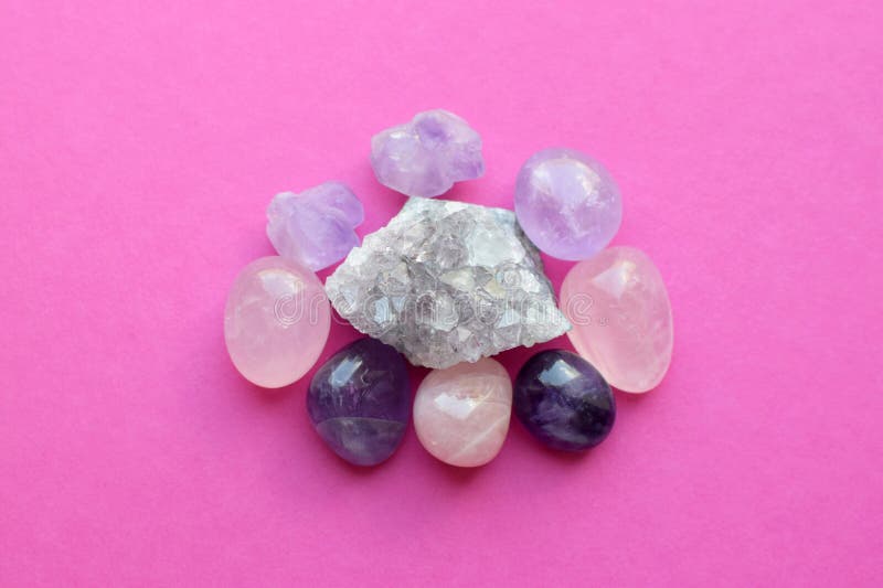 Tumbled Gems of Various Colors. Amethyst and Rose Quartz on Pink ...