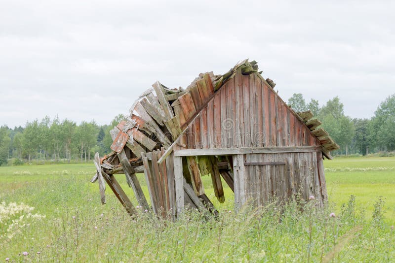Tumbledown barn on a field stock photo. Image of collapse - 57178732