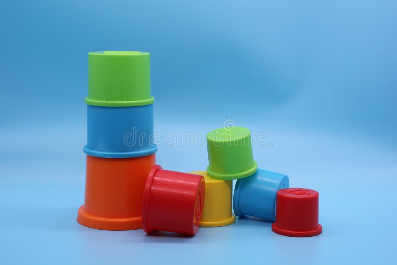 Tumbling Toy Tower on Blue Background Stock Photo - Image of stacking ...