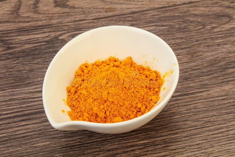 Tumeric powder in the bowl stock image. Image of aroma - 193237211