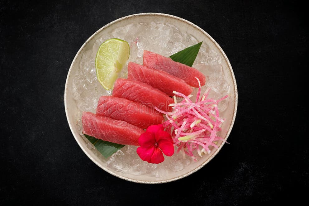 Tuna Sashimi with Lime and Ice on a Bamboo Leaf Stock Photo - Image of ...