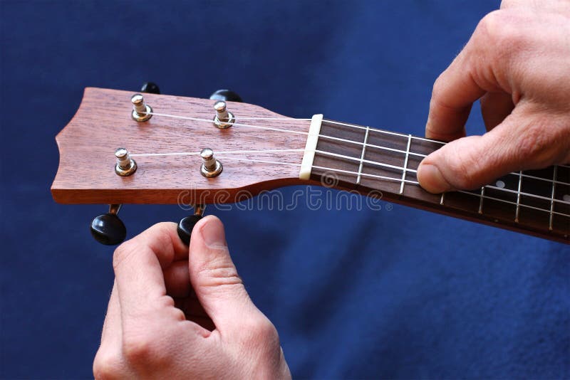 Tuning the First String of Ukulele, Closeup Stock Image - Image of ...