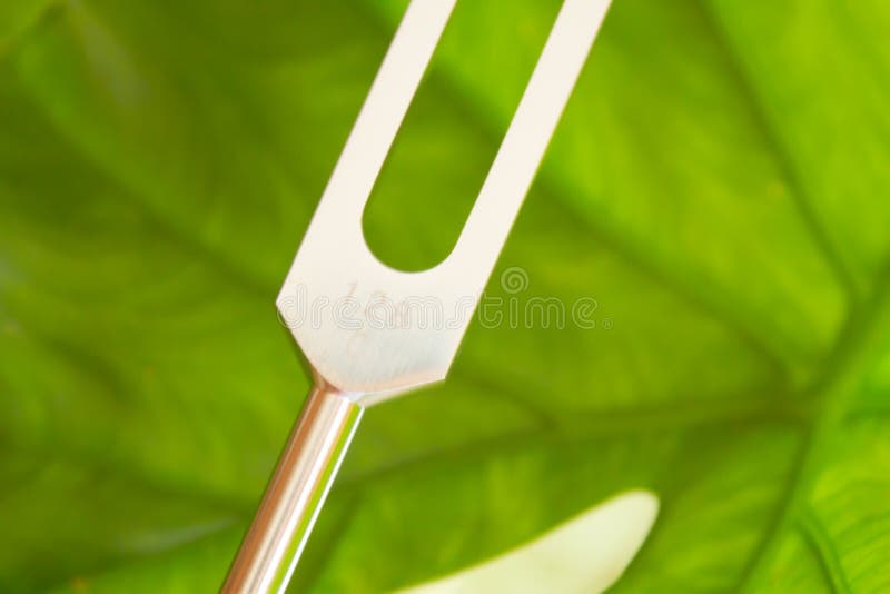 Tuning Fork and Crystal Stone on Table . Stock Image - Image of ...