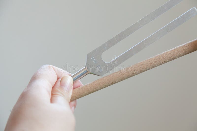 Tuning Fork and Crystal Stone on Table . Stock Image - Image of ...