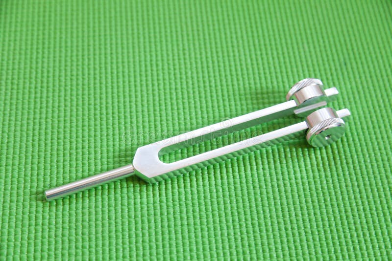 Tuning Fork and Crystal Stone on Table . Stock Image - Image of metal ...