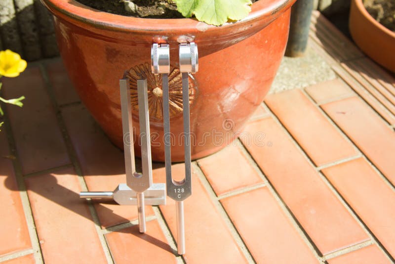 Tuning Fork and Crystal Stone on Table . Stock Photo - Image of ...