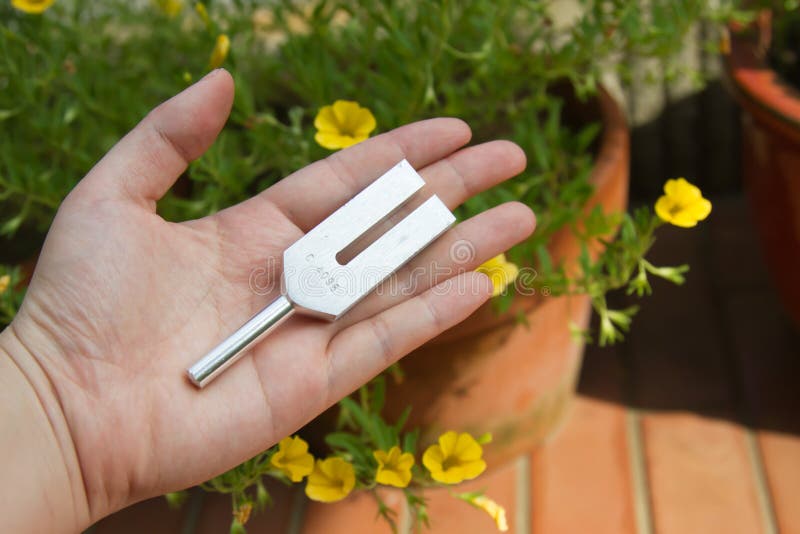 Tuning Fork and Crystal Stone on Table . Stock Image - Image of ...