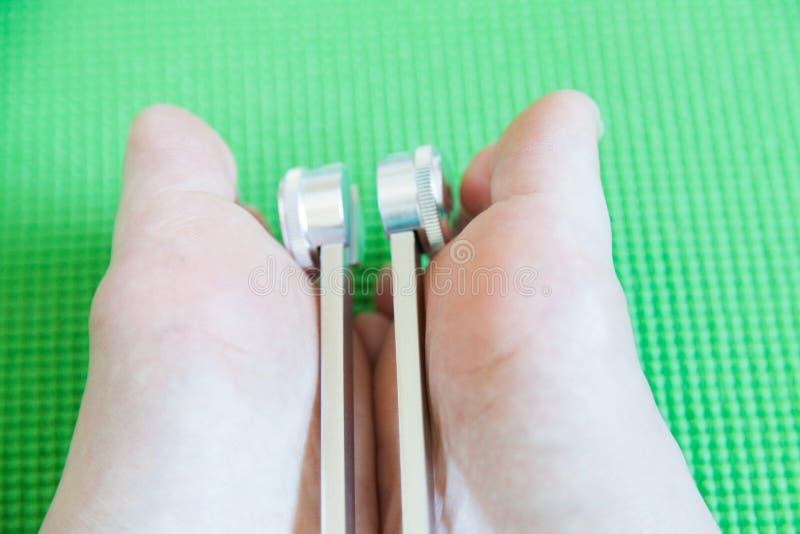 Tuning fork and feet stock image. Image of instrument - 171126193