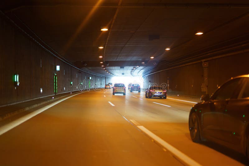 Tunnel on a Road with Cars and Night Lighting Stock Photo - Image of ...