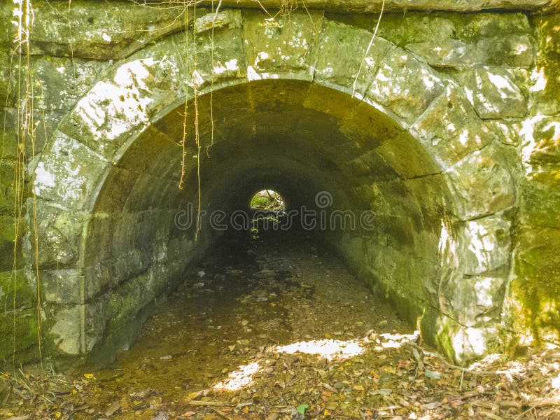 Tunnel with Small Creek Running through it Stock Image - Image of ...
