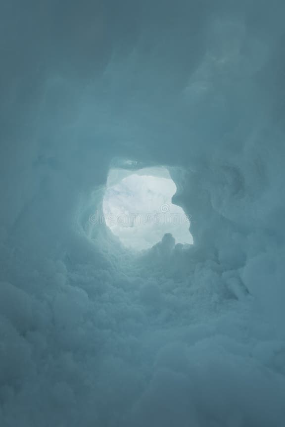 Tunnel in the Snow with Hole Opening To the Light Exit Stock Image ...
