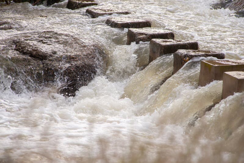 A Turbid, Muddy Rushing Stream of Overflowing River Water. Flood Stock ...