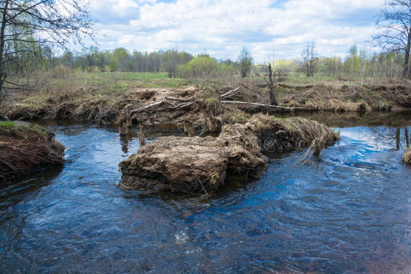 The Turbulent Flow of a Small River Eroding Banks. Stock Photo - Image ...