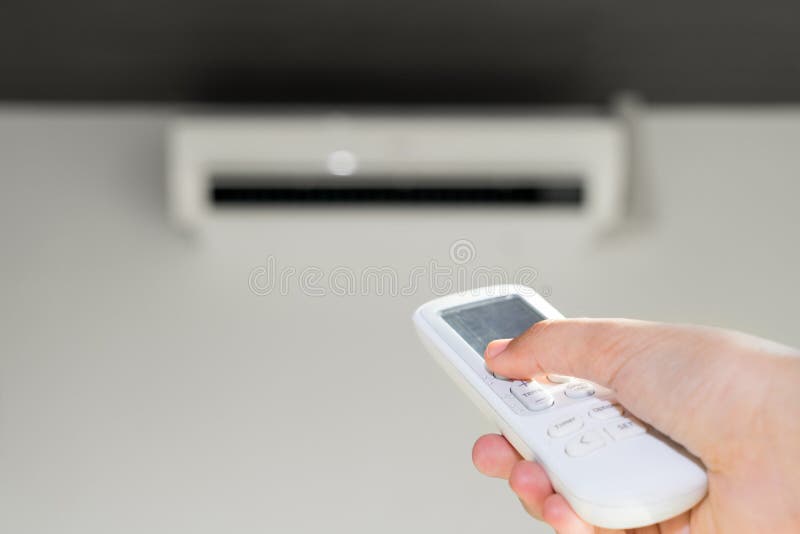 Turing on, Turning Off the Air Condition by Remote Control Stock Photo ...