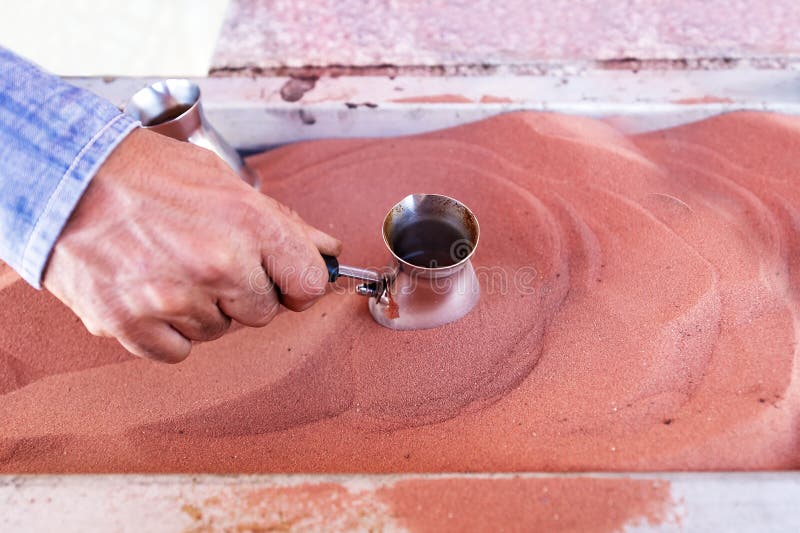 Turk with Coffee on Hot Sand. Preparing Coffee in Hot Sand Stock Image ...
