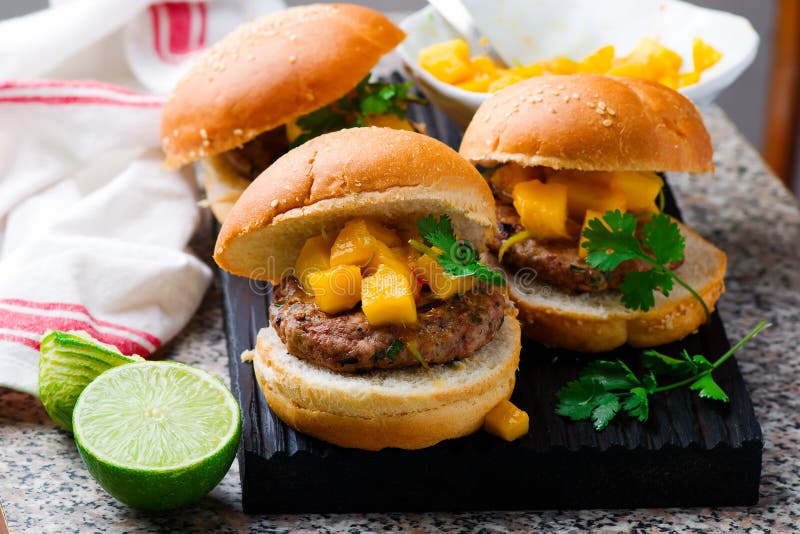 Turkey Burgers with Mango Salsa.style Rustic Stock Photo - Image of ...