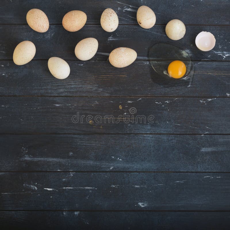 Turkey Eggs and One Broken Egg on Rough Dyed Wooden Surface. Stock ...