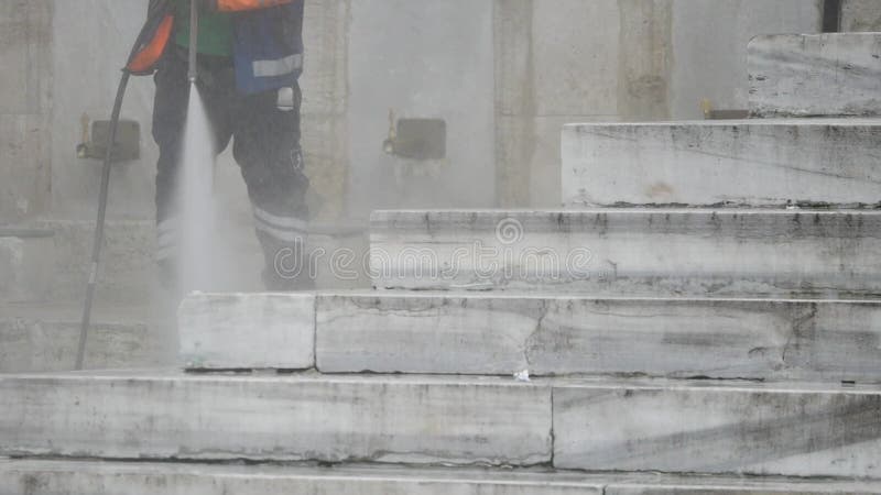 Turkey Istanbul 17 March 2025. Worker Cleans Stone Steps Using Pressure ...